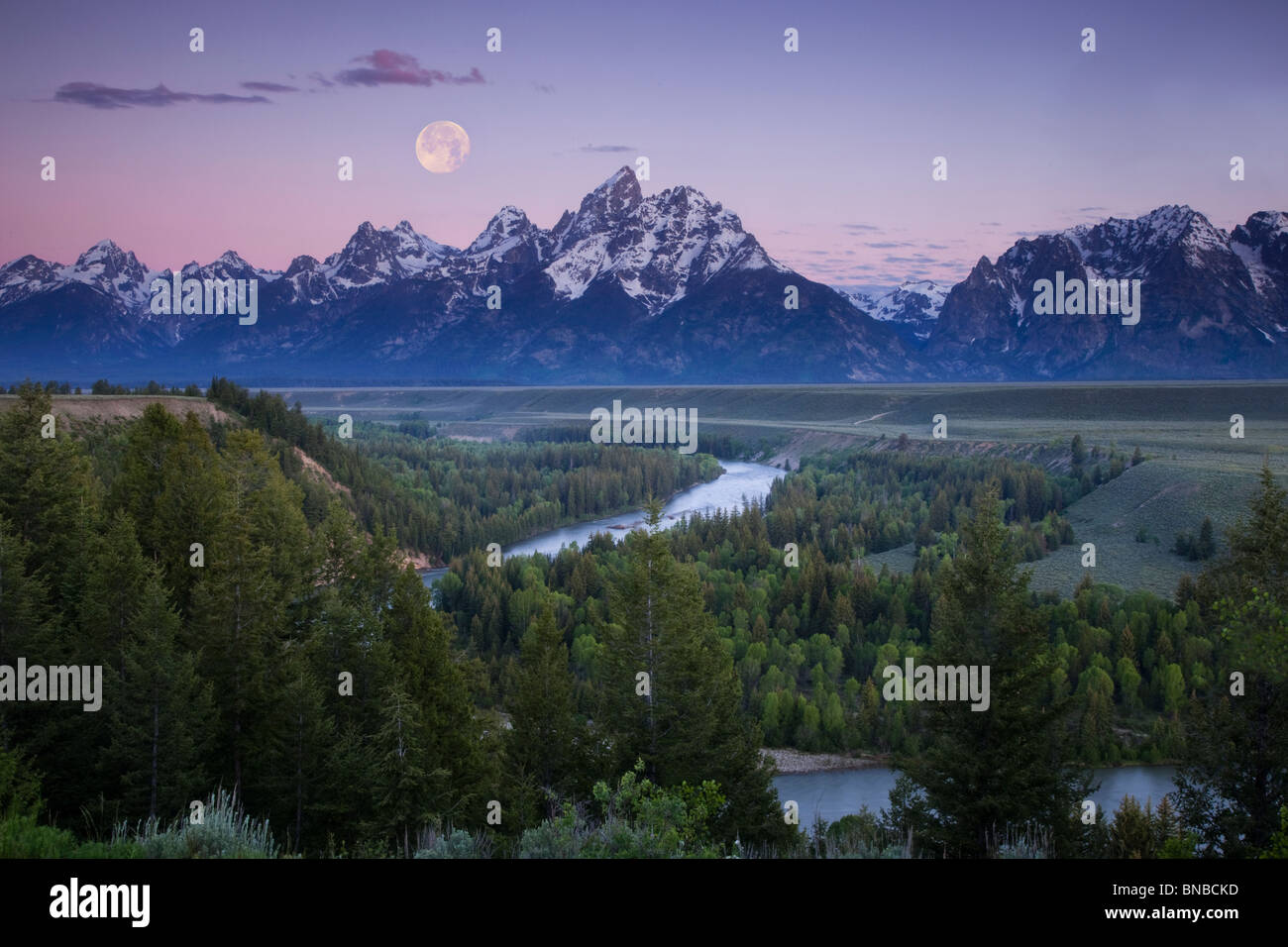 Full moon over snow capped hi-res stock photography and images - Alamy