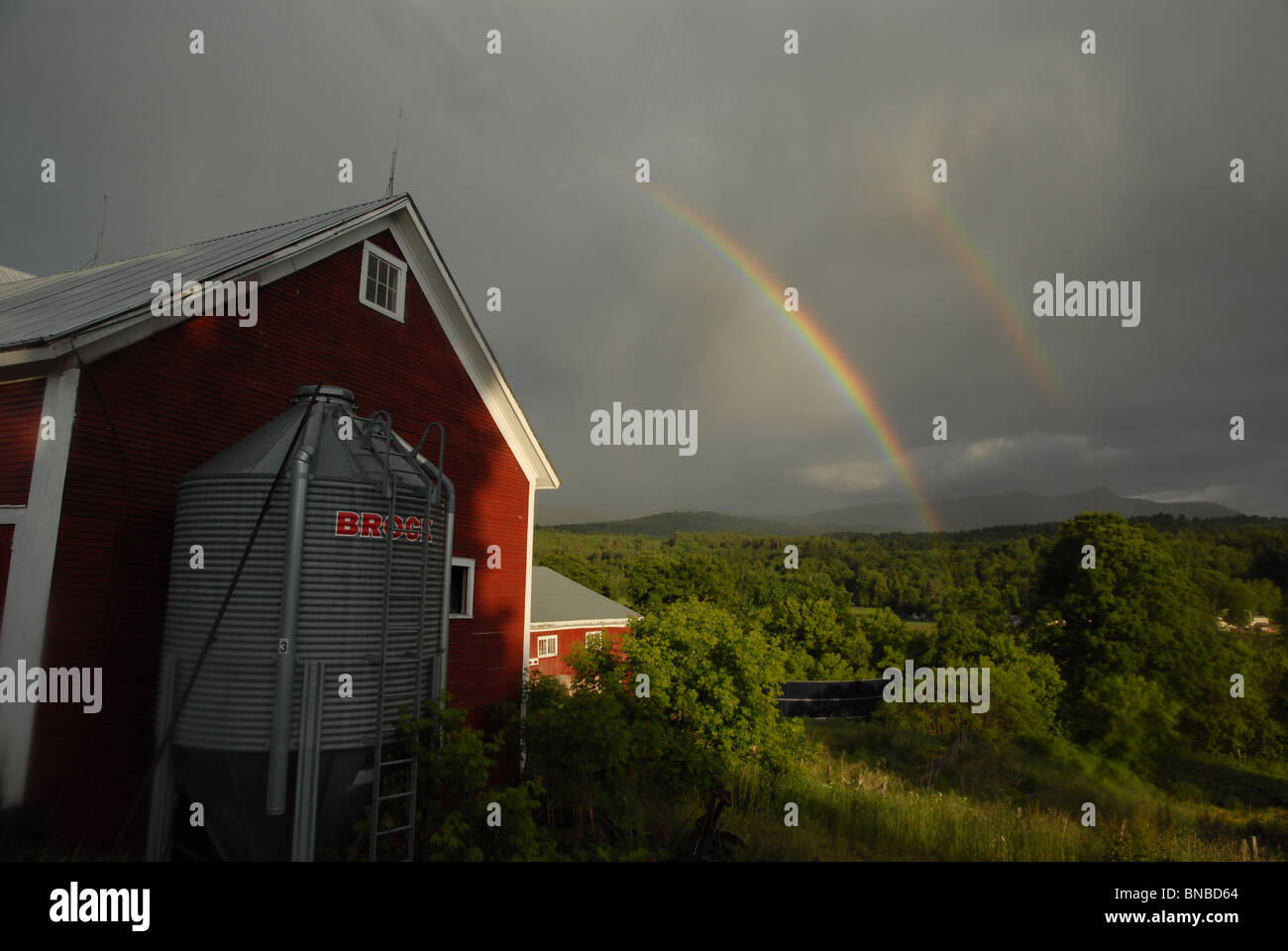 A double rainbow crosses the sky near a barn in Waitsfield, Vermont ...