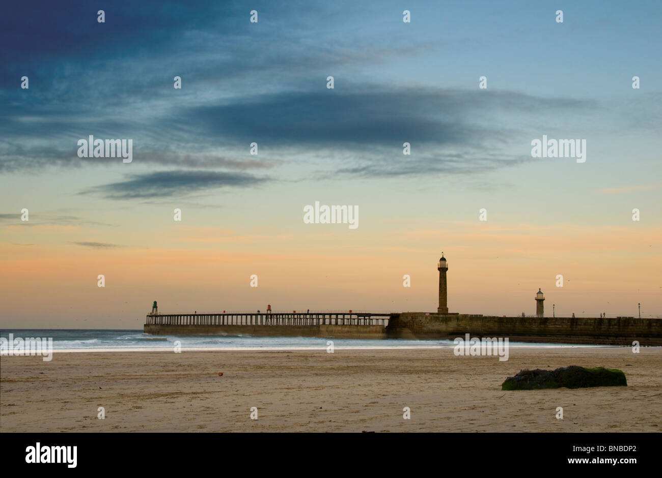 Whitby beach and pier Stock Photo - Alamy
