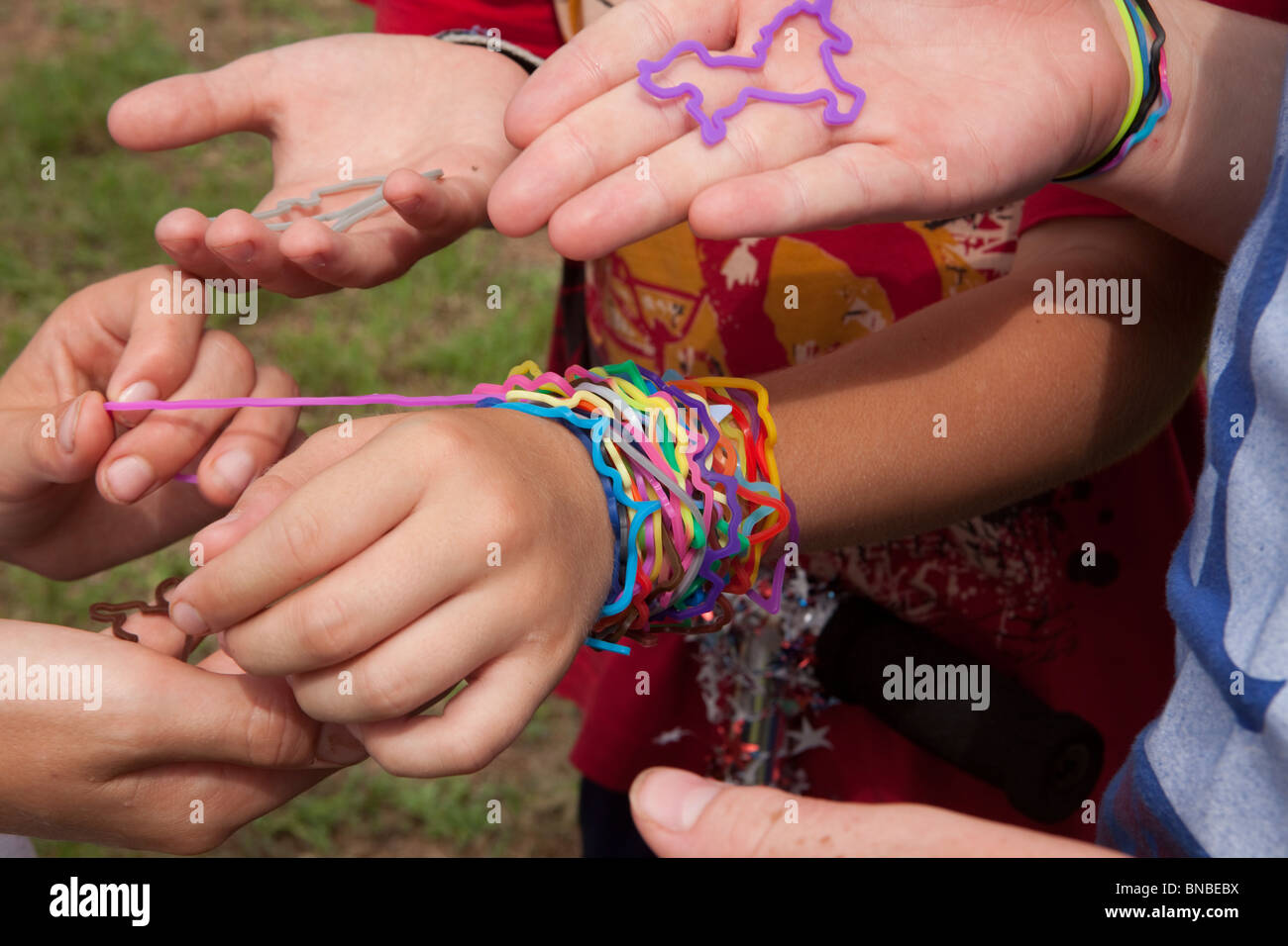 Austin, Texas USA, July 2010: Pre-teen boys trade Silly Bandz at park ...