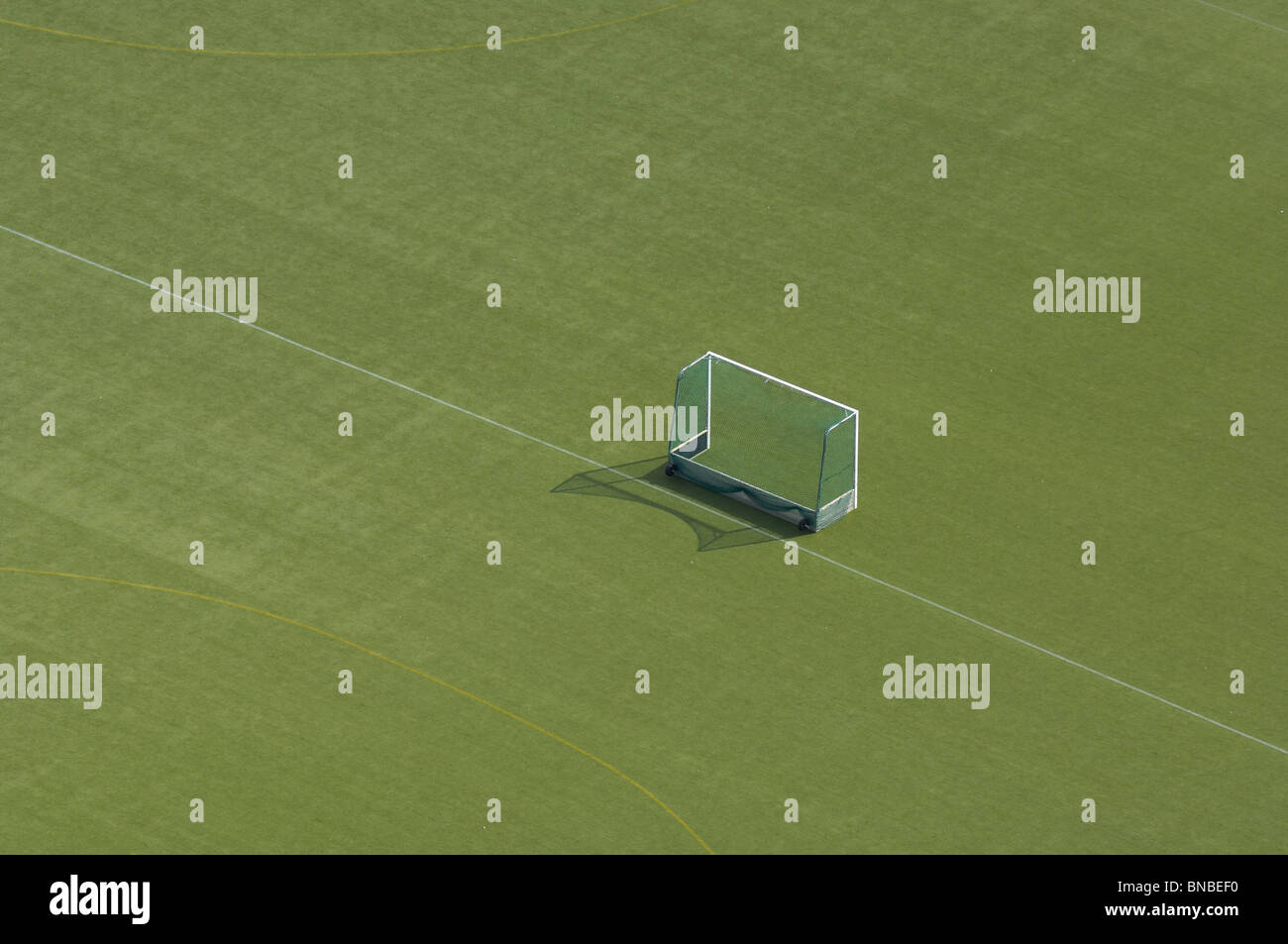 goal on playing field with grass viewed from above, border line of the ...
