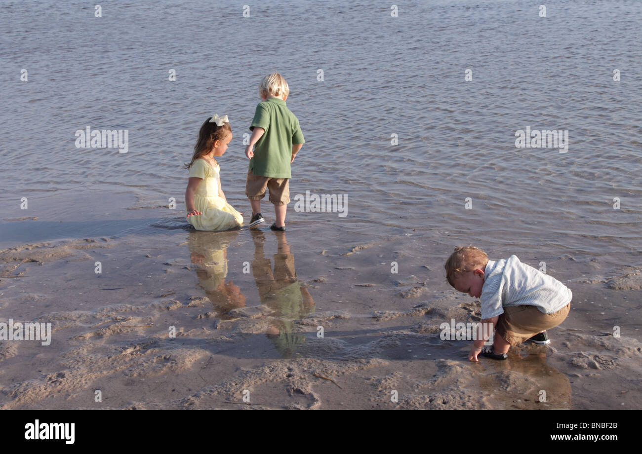 Three Children on the Beach Stock Photo - Alamy