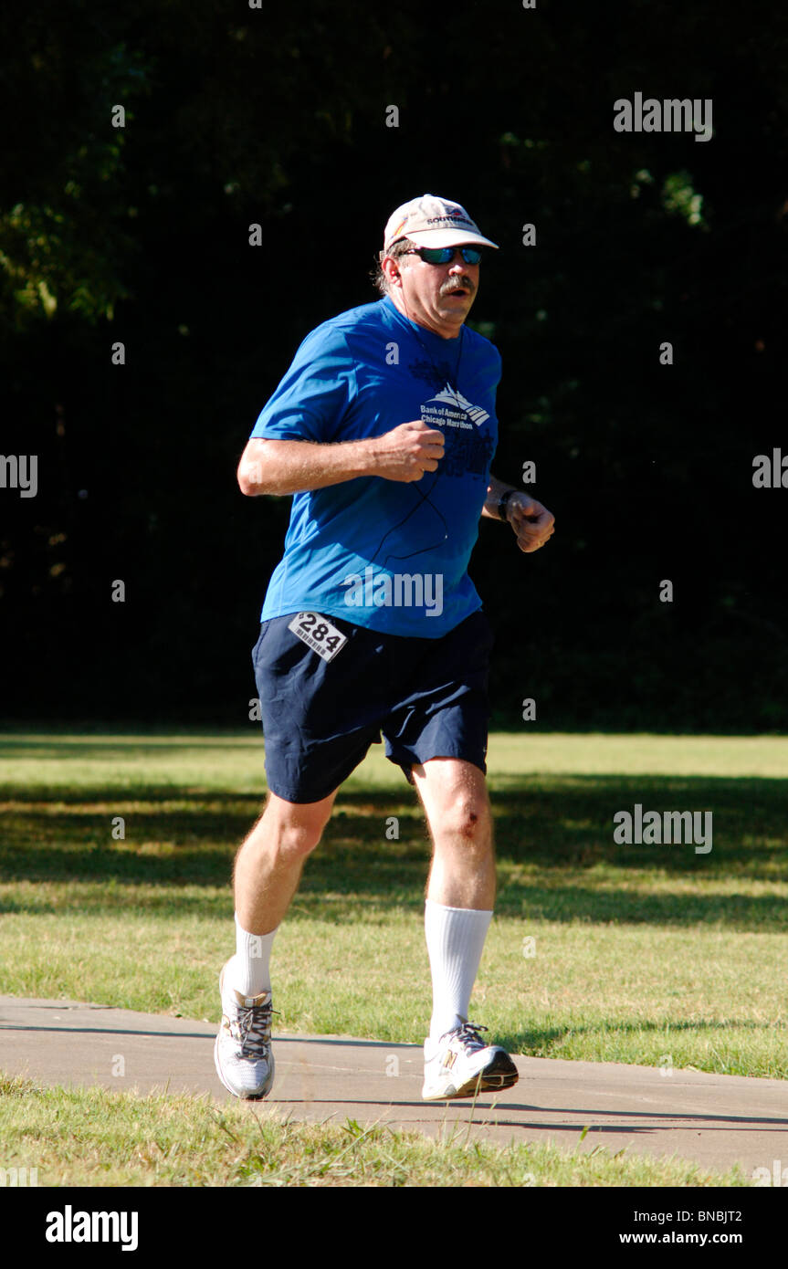 Male and female Marathon runners and joggers of all ages, shapes, sizes ...