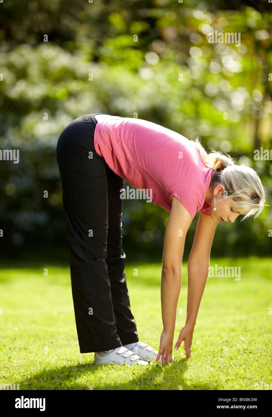 Woman relaxing after exercise Stock Photo - Alamy