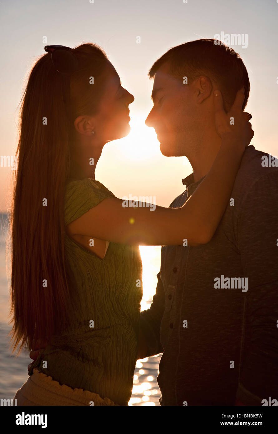 Couple kissing at beach Stock Photo - Alamy