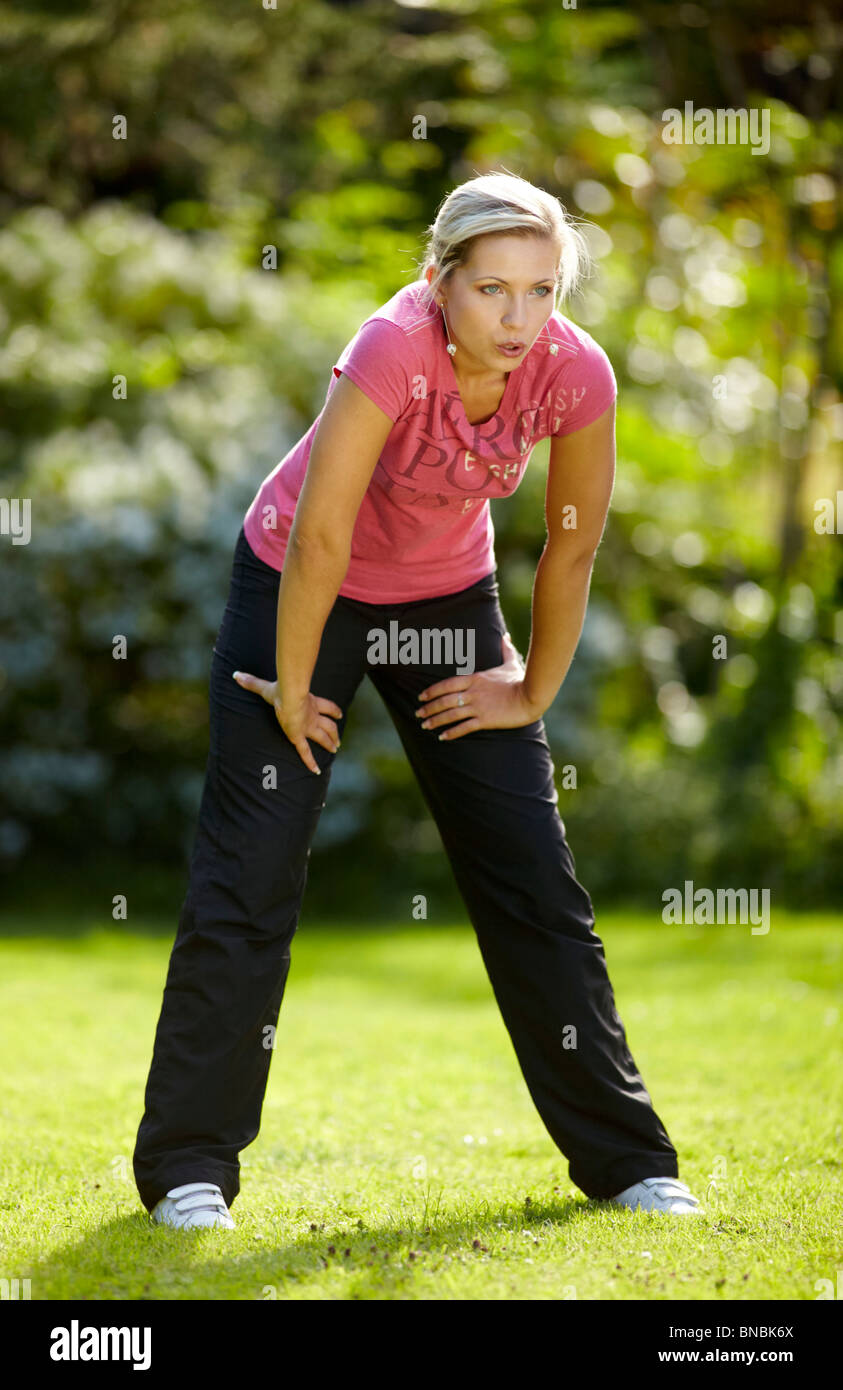 Woman relaxing after exercise Stock Photo - Alamy