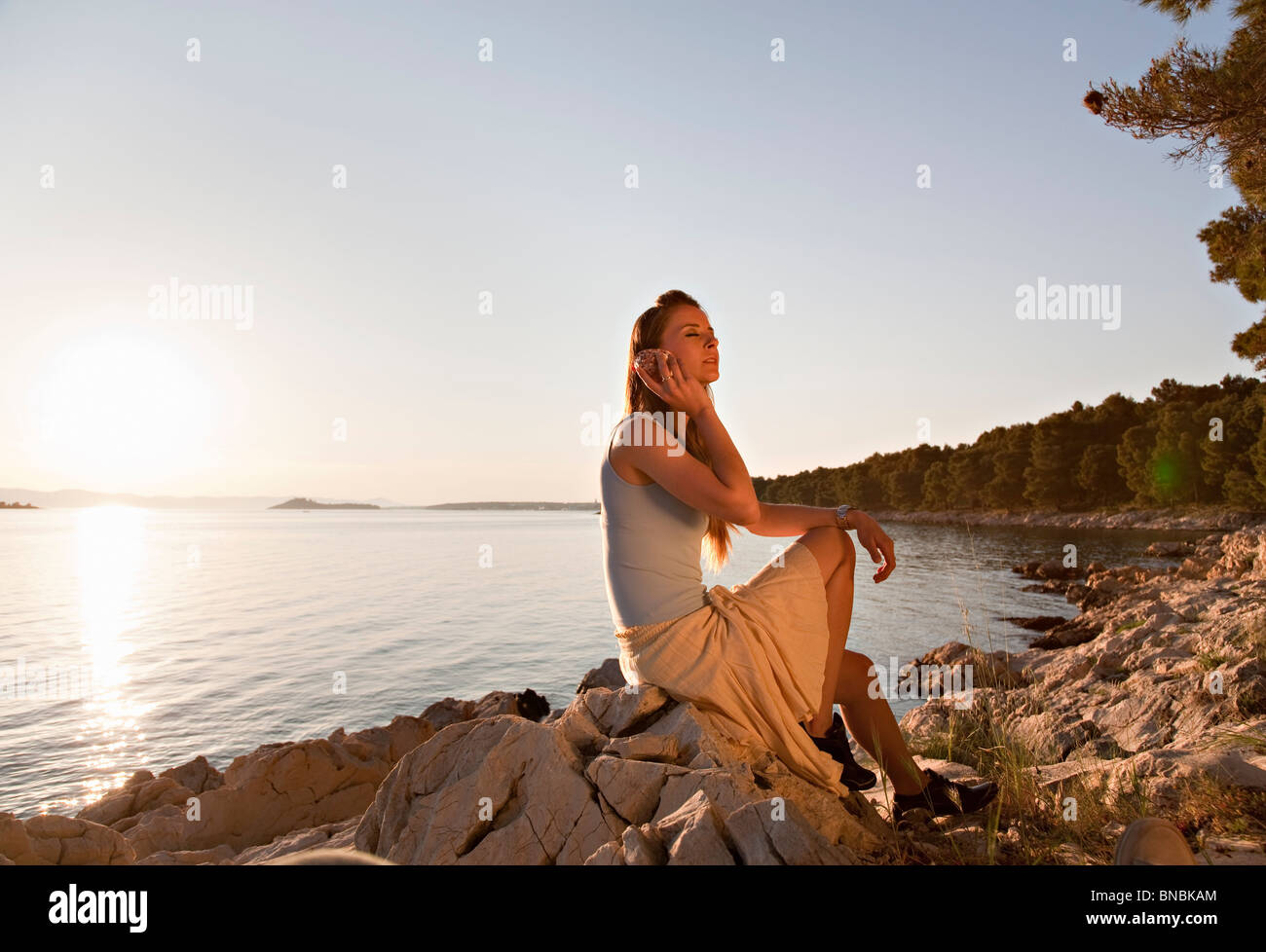 Woman shell beach hi-res stock photography and images - Alamy