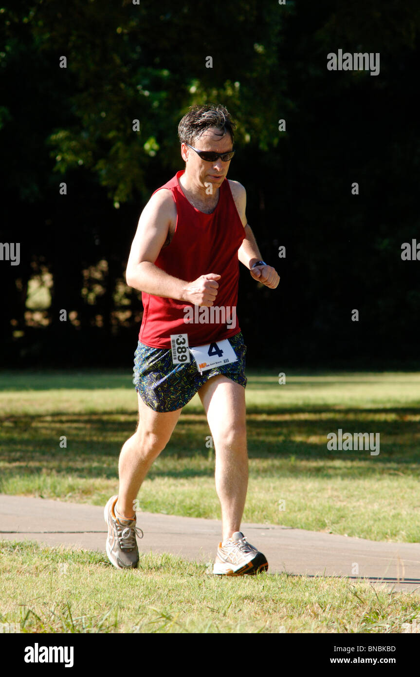 Male and female Marathon runners and joggers of all ages, shapes, sizes ...