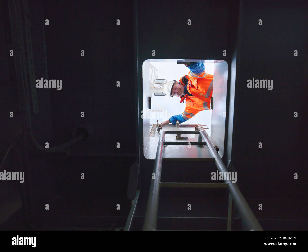 Sailor looking through hatch Stock Photo - Alamy