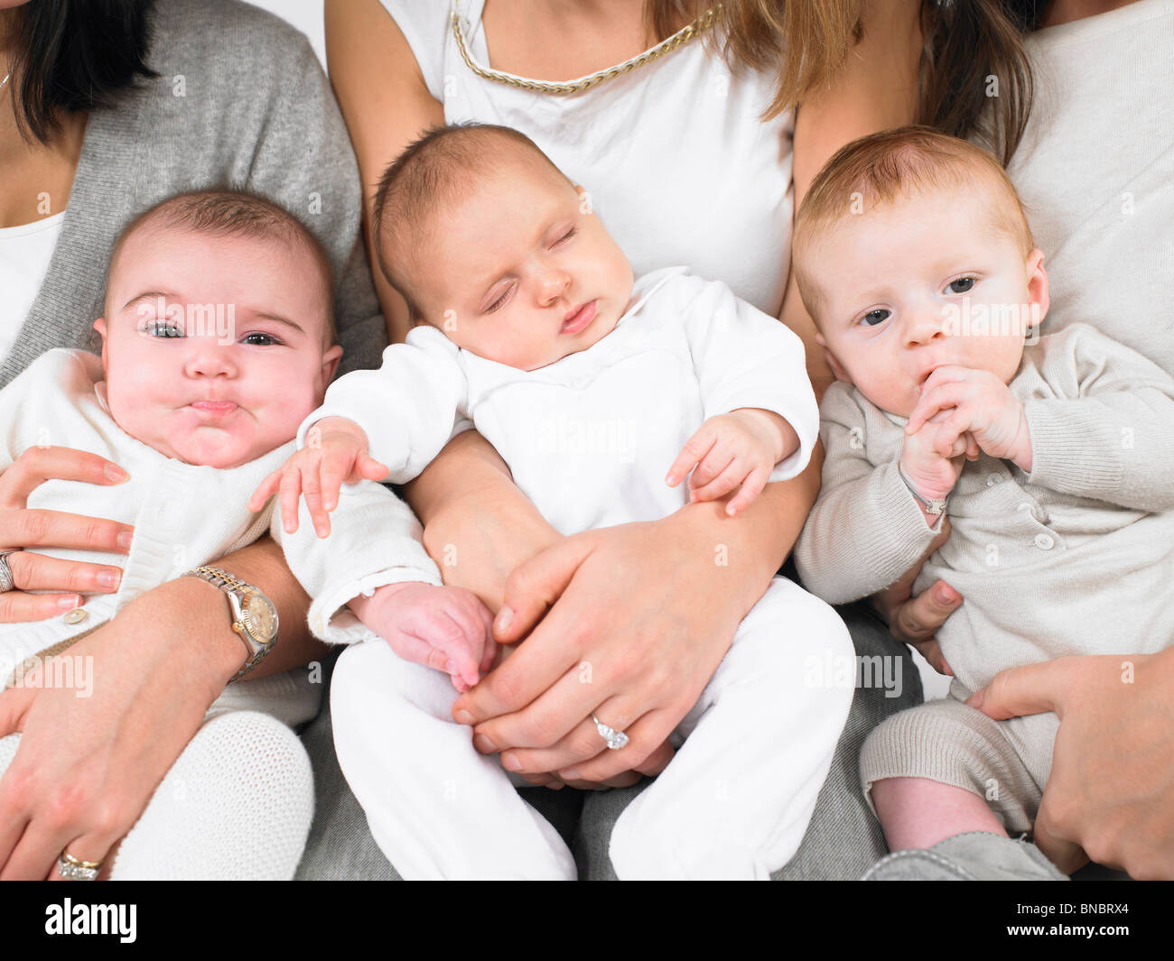 Woman three babies hi-res stock photography and images - Alamy