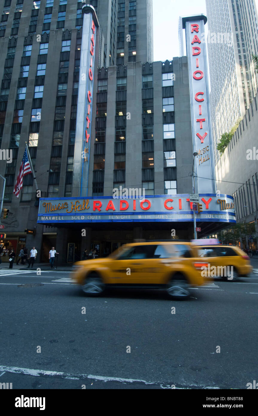 Yellow Cab taxis pass Radio City Music Hall, Manhattan, New York Stock ...