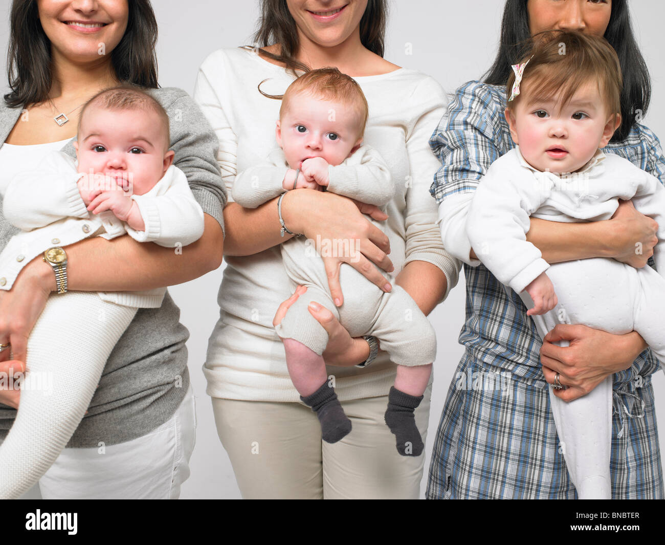 Human babies in a row hi-res stock photography and images - Alamy