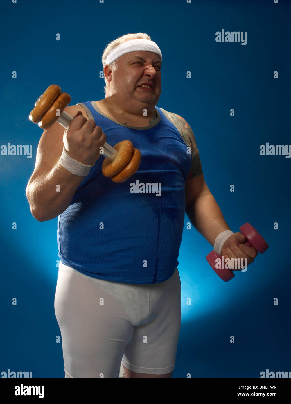 Large man lifting weights Stock Photo - Alamy