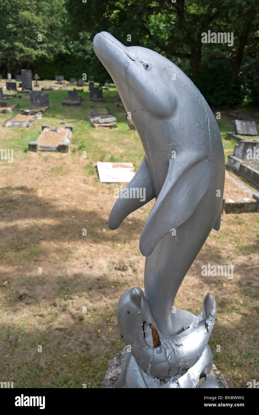 dolphin figure in wood forming part of a gravestone at east sheen ...