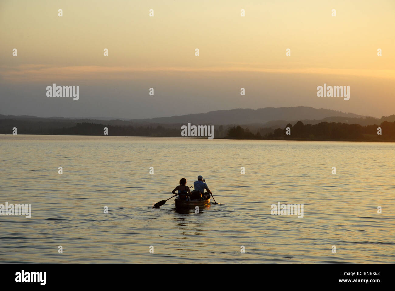 Rowing boat in dusk hi-res stock photography and images - Alamy
