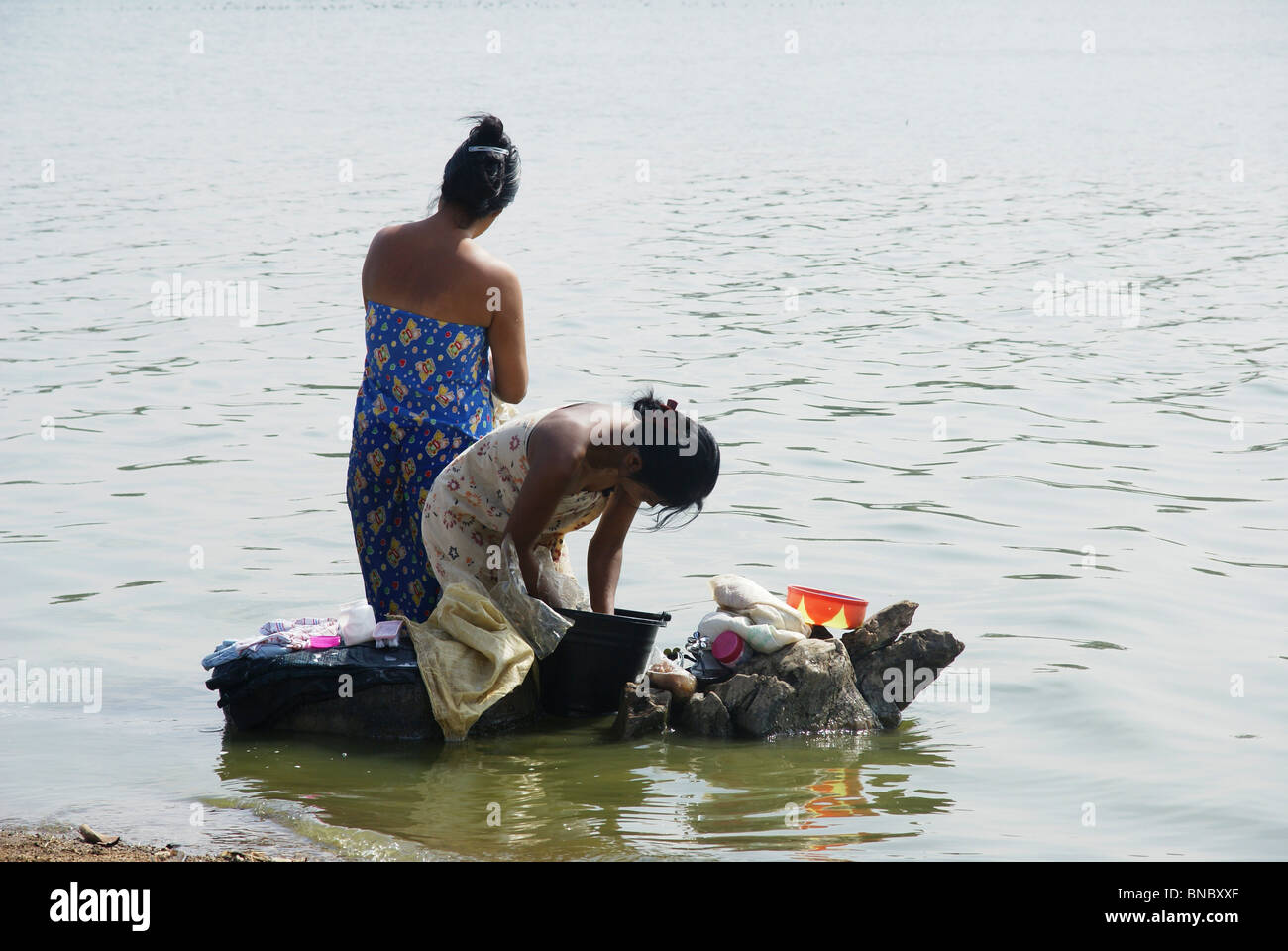 Women washing clothes in lake hi-res stock photography and images - Alamy