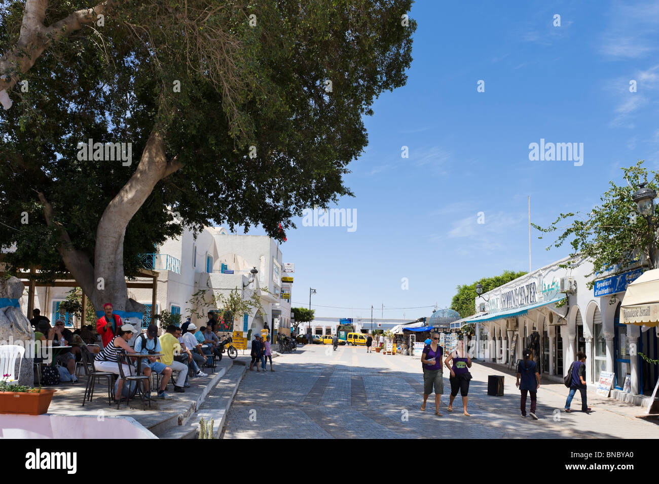 Shops and sidewalk cafe in the centre of Midoun, Djerba, Tunisia Stock ...