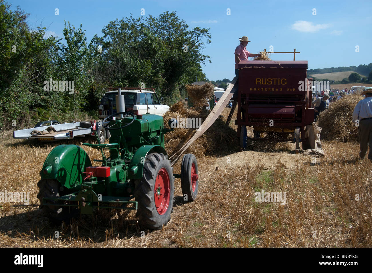 A historic threshing machine Stock Photo - Alamy