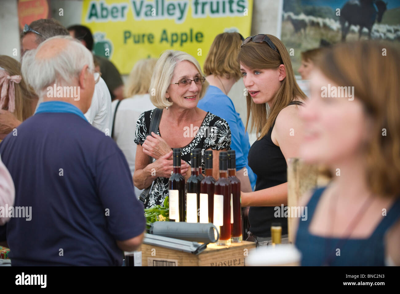 People tasting samples of food on stalls at Hay Food Festival in the ...