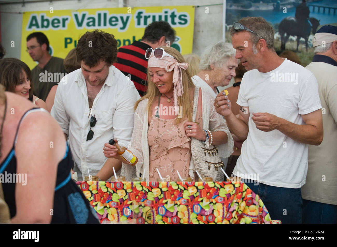People tasting samples of food on stalls at Hay Food Festival in the ...