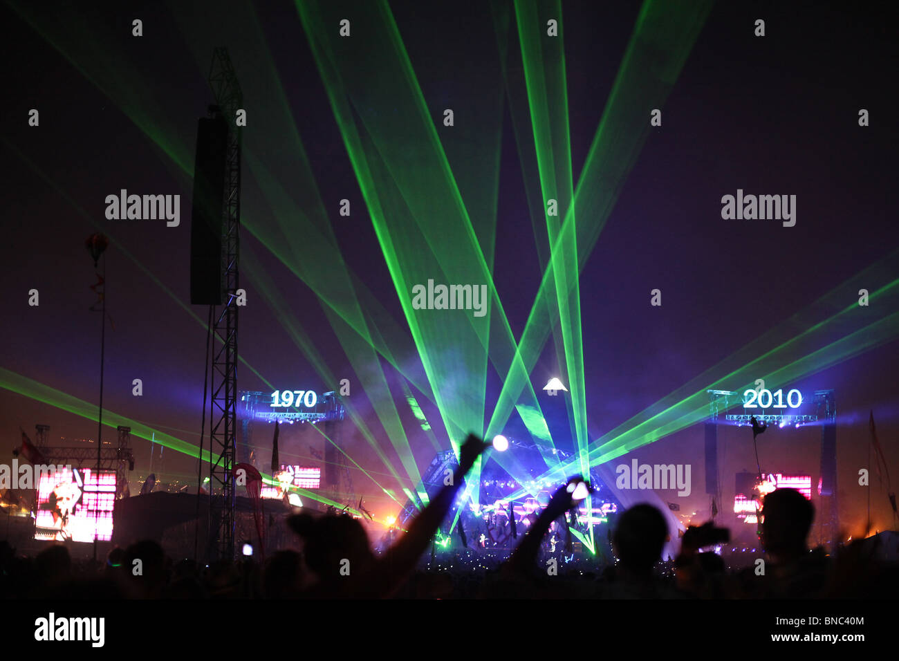 Muse performing on the Pyramid stage at Glastonbury 2010 Stock Photo ...