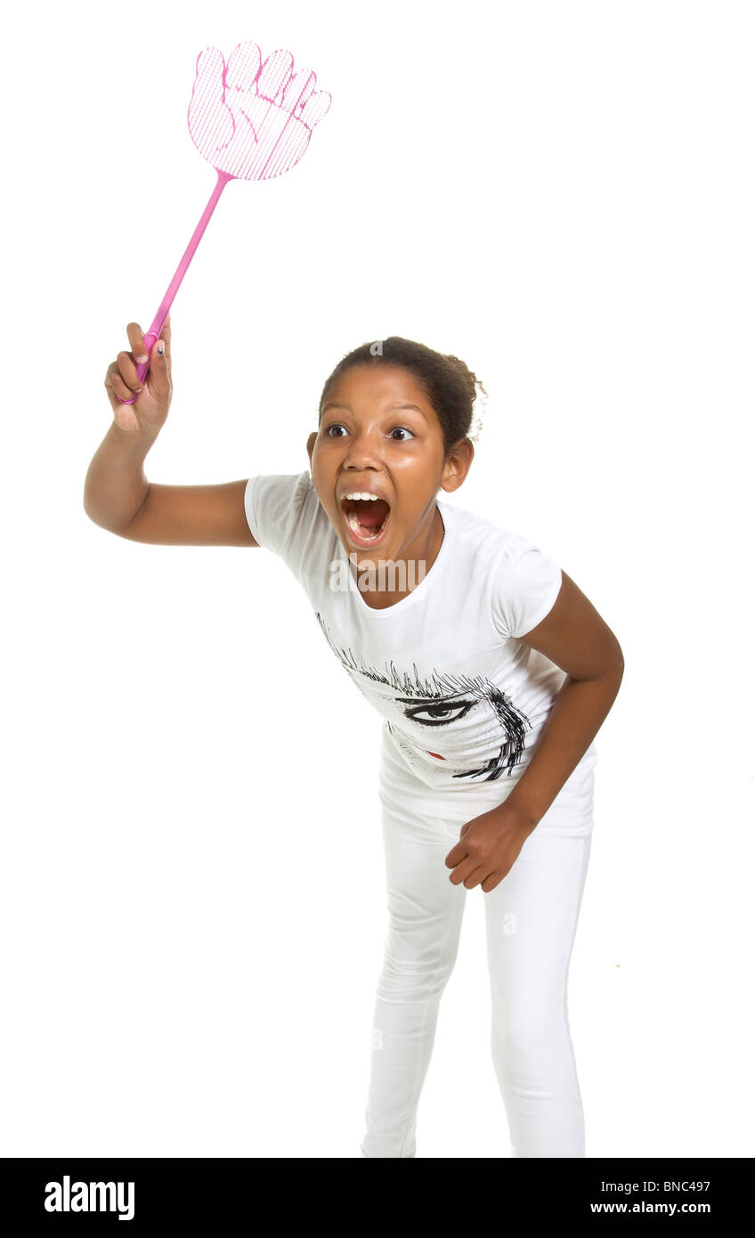beautiful young mixed race girl with pink fly swatter isolated against ...