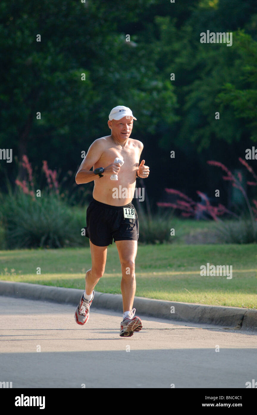 Male and female Marathon runners and joggers of all ages, shapes, sizes ...