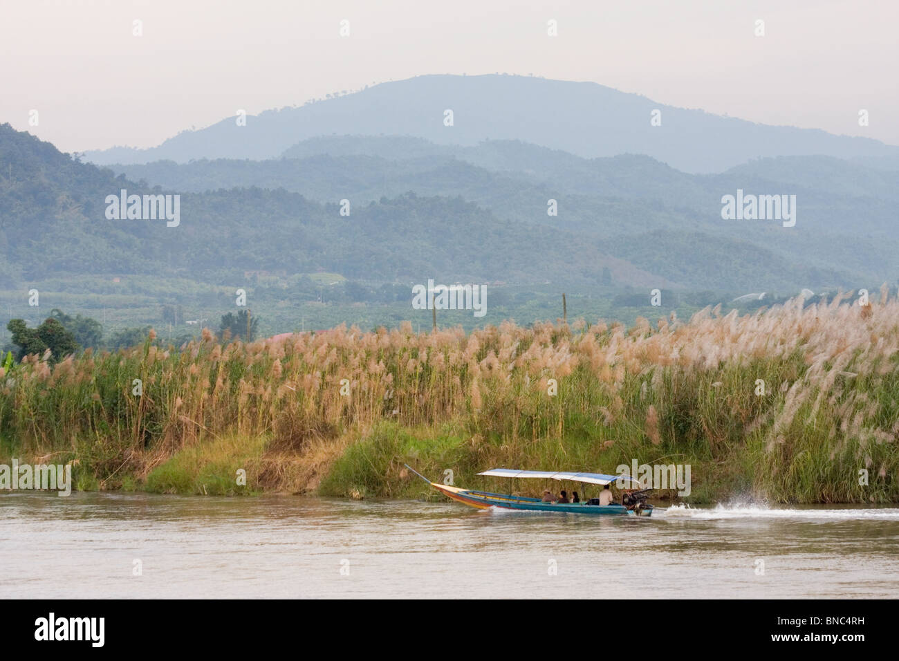 Boat travelling along a river, Tha Ton, Chiang Mai Province, Thailand ...