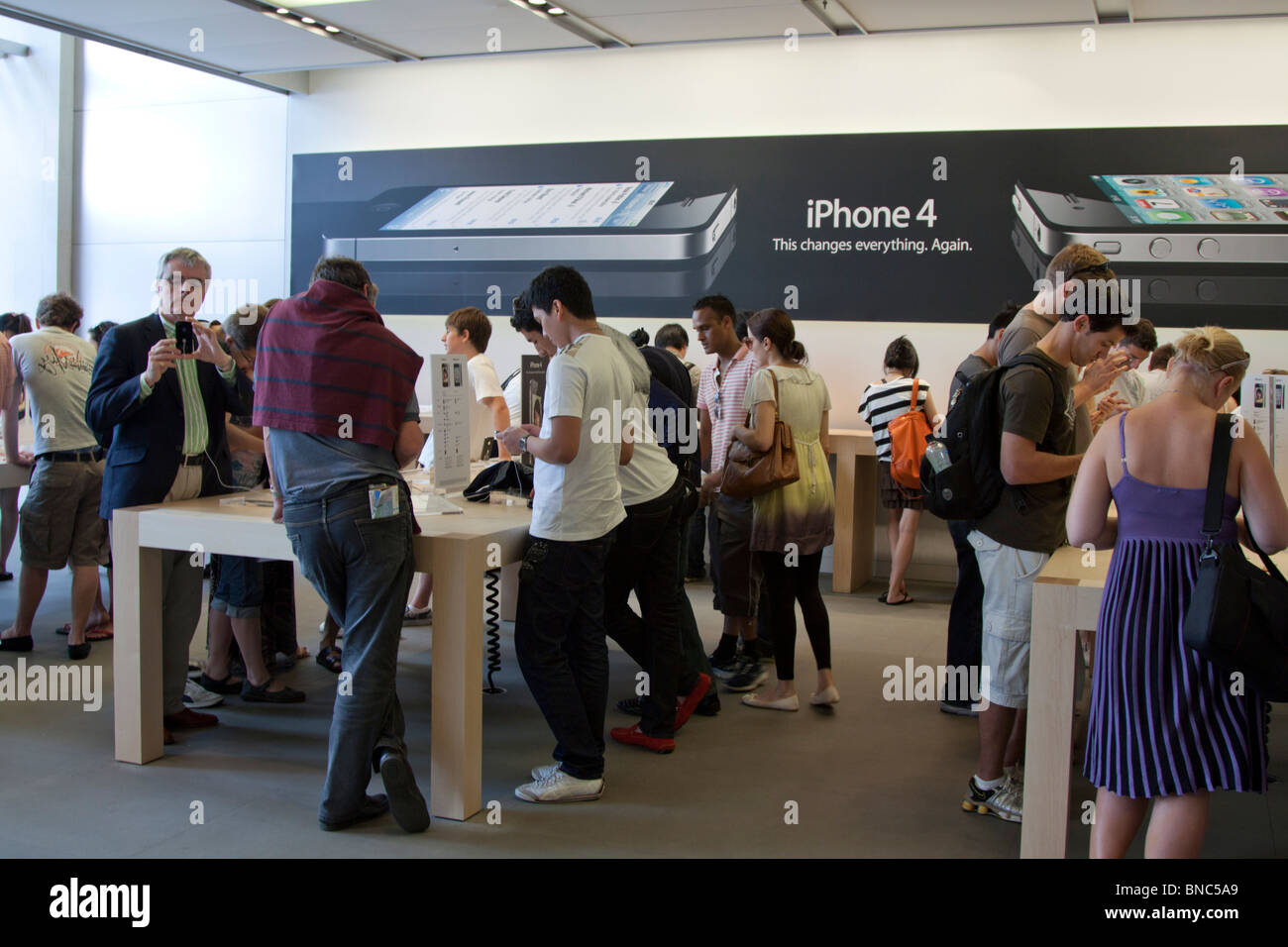 People using iPhone 4 - Apple Store - Regents Street - London Stock ...