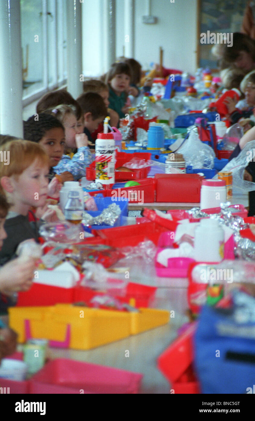 Nursery school children at lunch table North London England Stock Photo ...