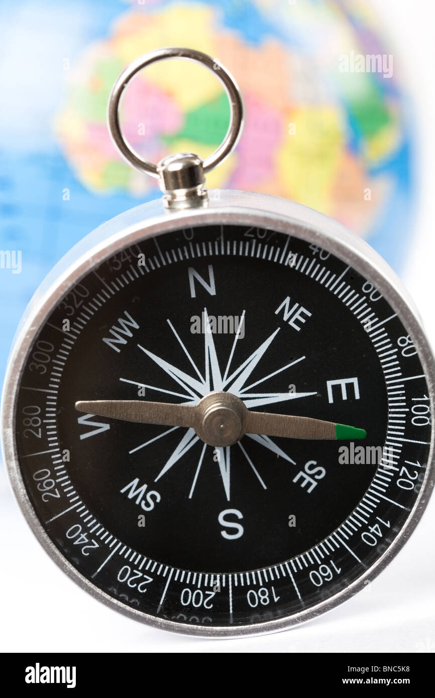 Compass and Globe close up shot Stock Photo - Alamy