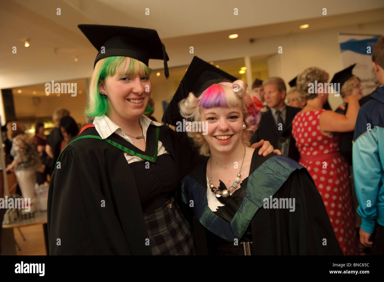 two women students at Aberystwyth University Graduation day, Wales UK ...