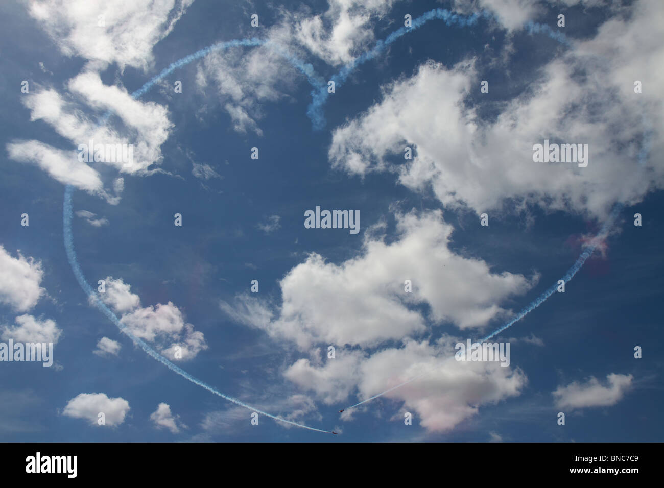 Smoke Trails in the shape of a love heart made by the Red Arrow ...
