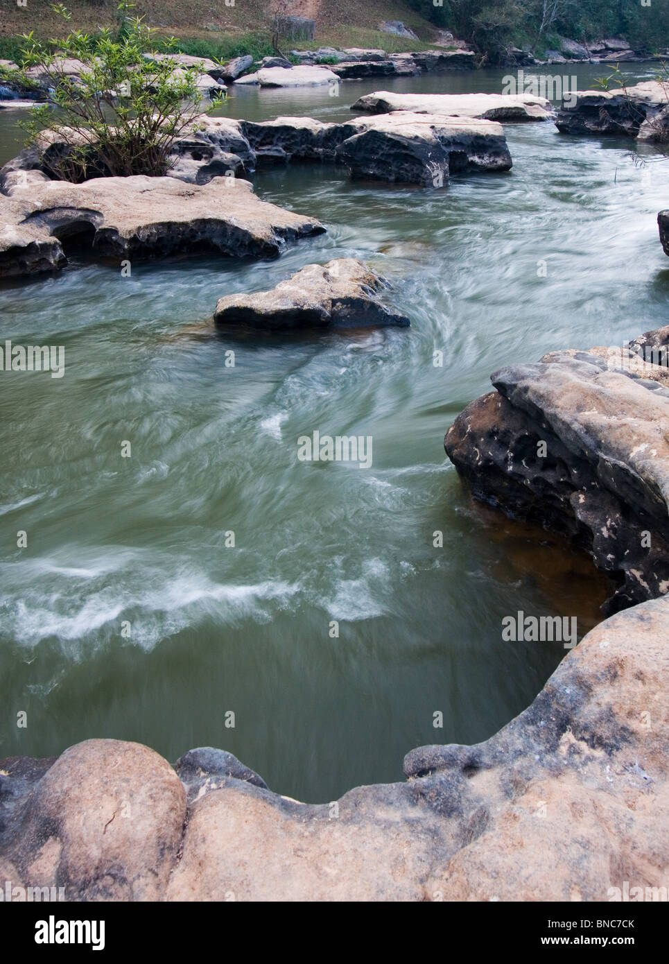 Rock formations by a river, Thung Salaeng Luang National Park, Thailand ...
