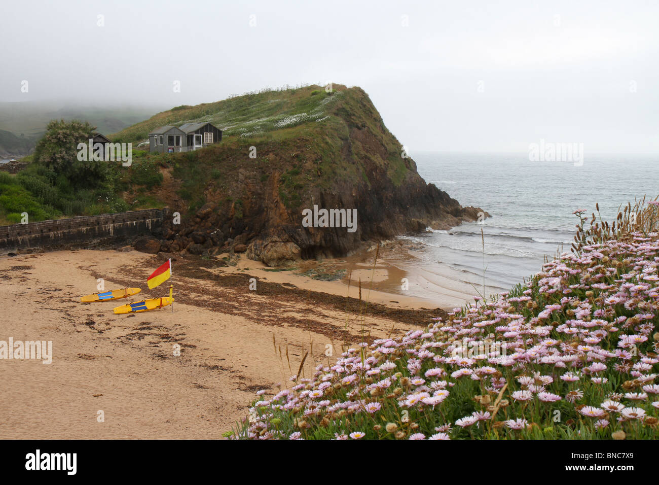 Hope Cove in Southern Devon, England on a misty day. The RNLI ...