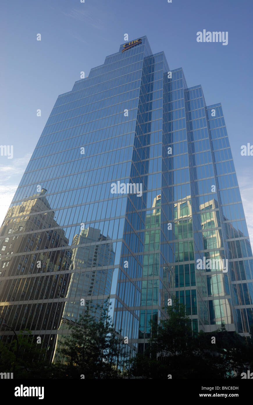 CIBC glass tower reflecting surrounding buildings in the downtown City ...