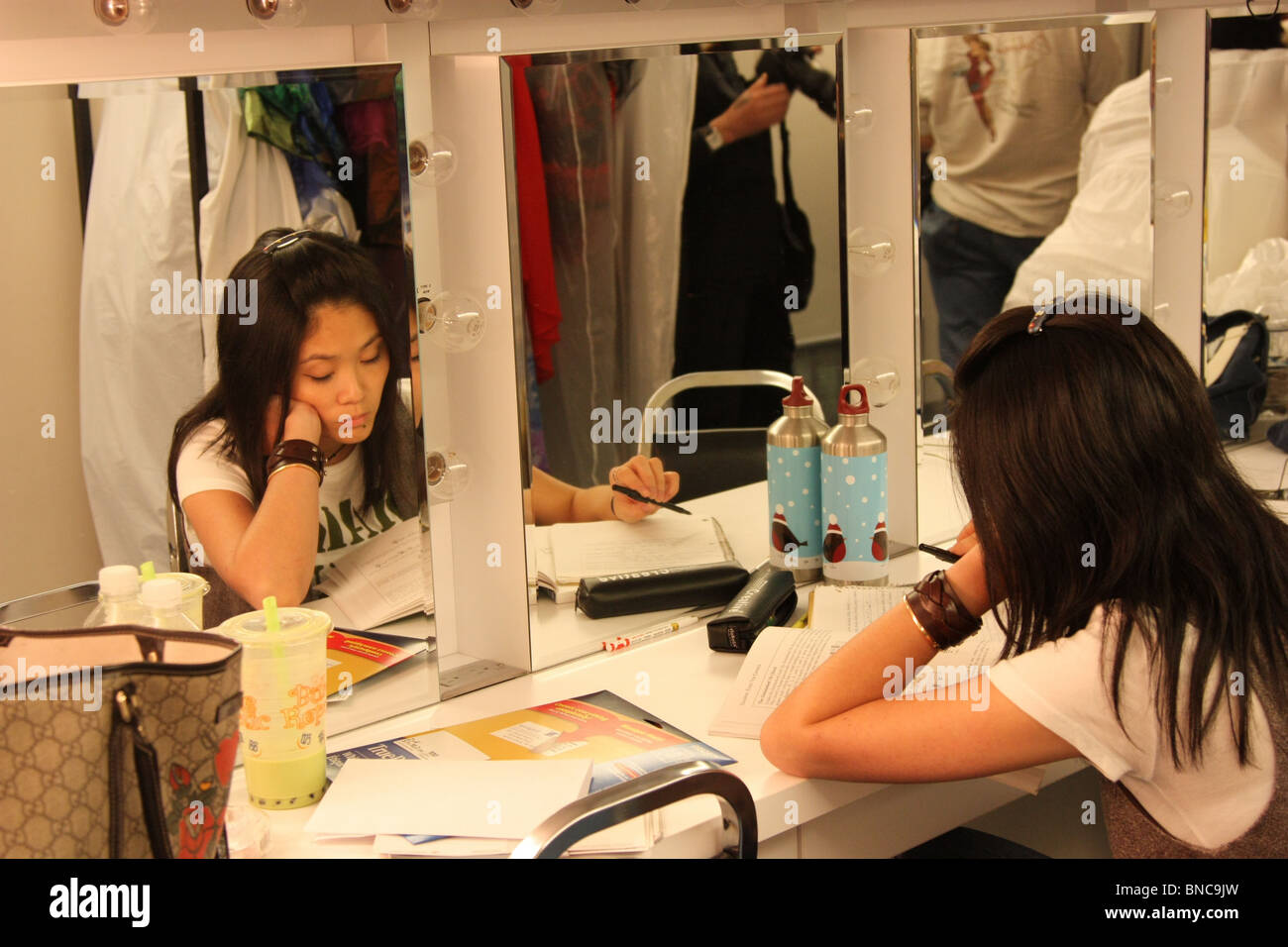 asian female student studying mirror reflection Stock Photo - Alamy