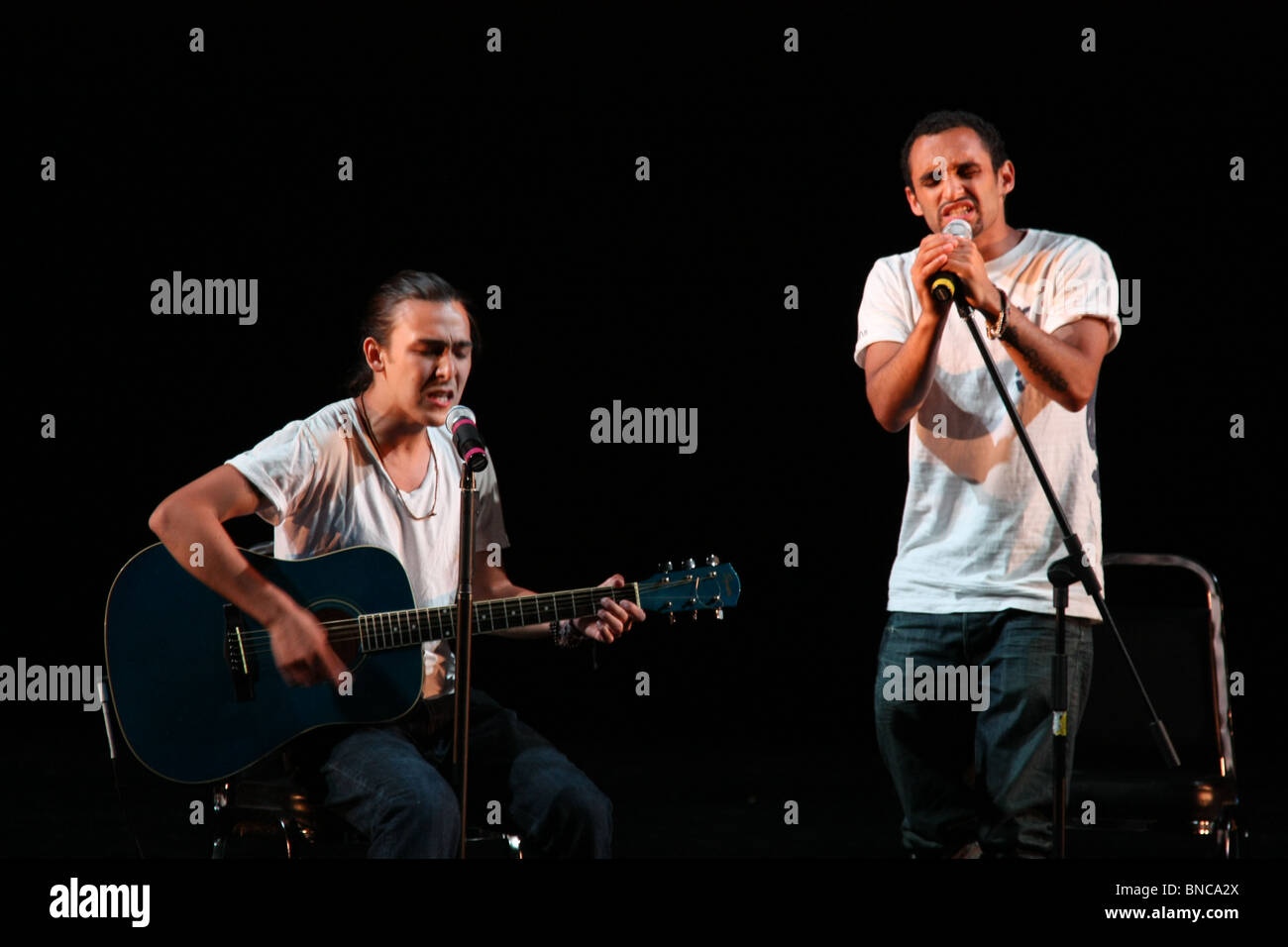 band male guitar guitarist singer microphone song Stock Photo - Alamy