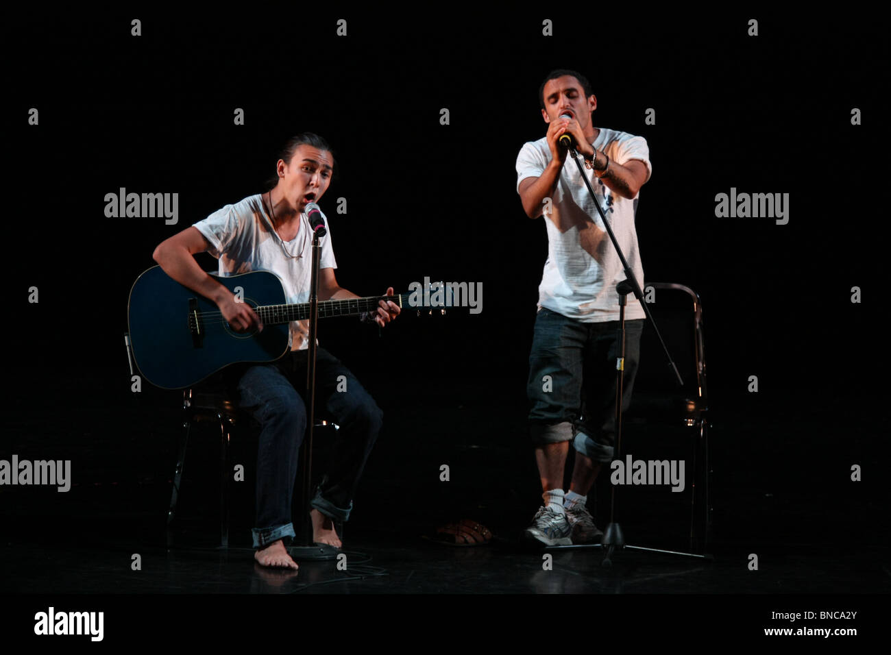 band male guitar guitarist singer microphone song Stock Photo - Alamy