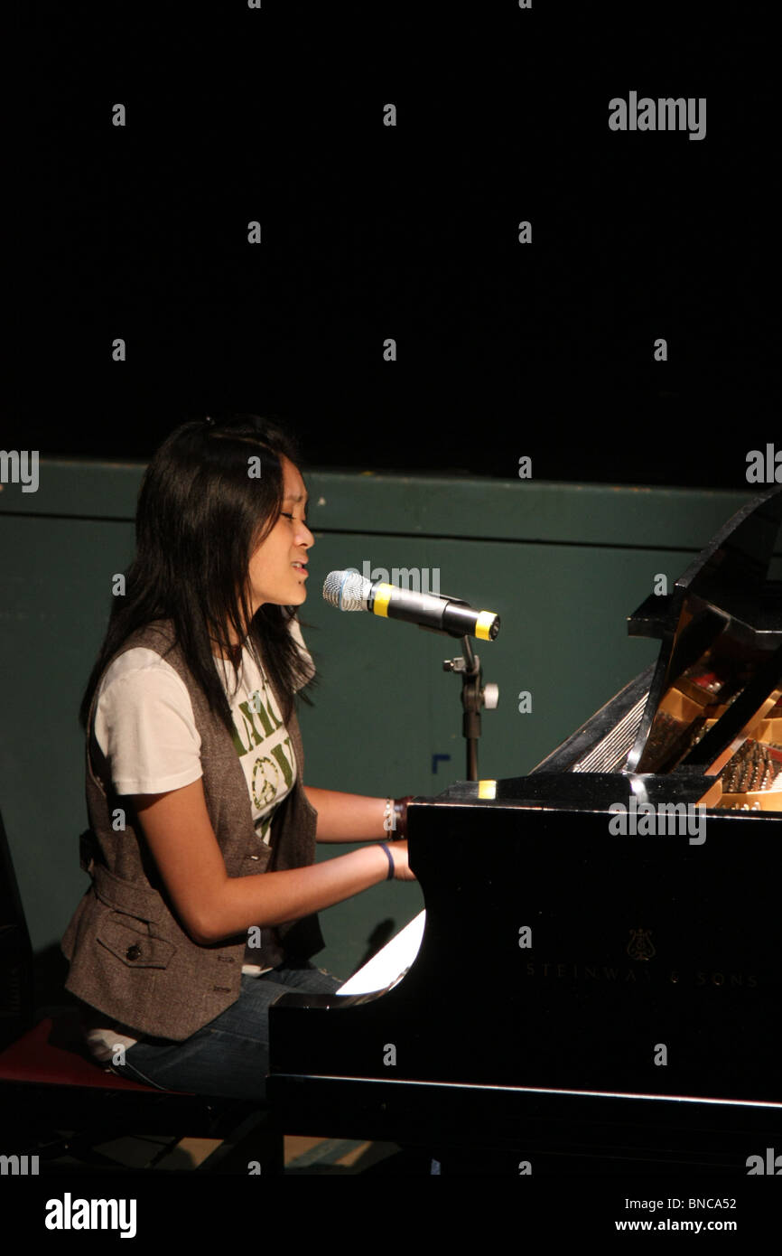 young asian female piano player singer performance Stock Photo - Alamy