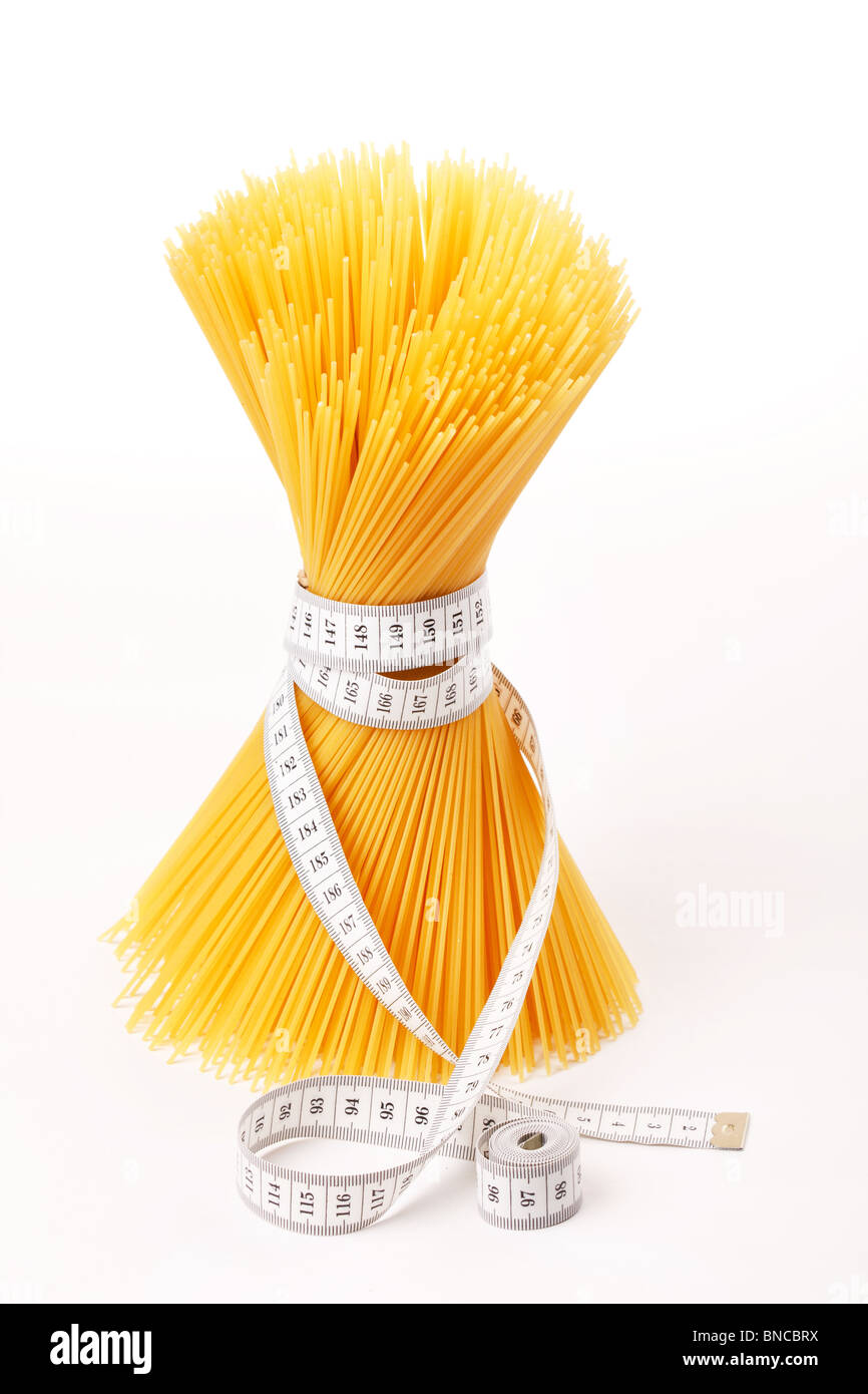 Spaghetti with measuring tape Stock Photo - Alamy