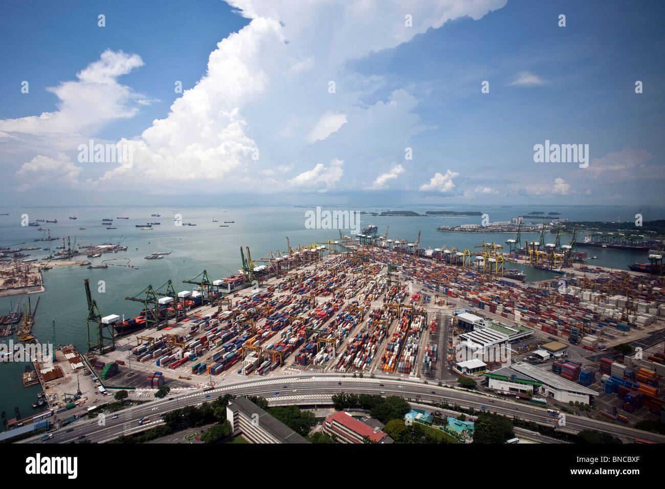 An elevated view shows containers and container ships in the port of ...