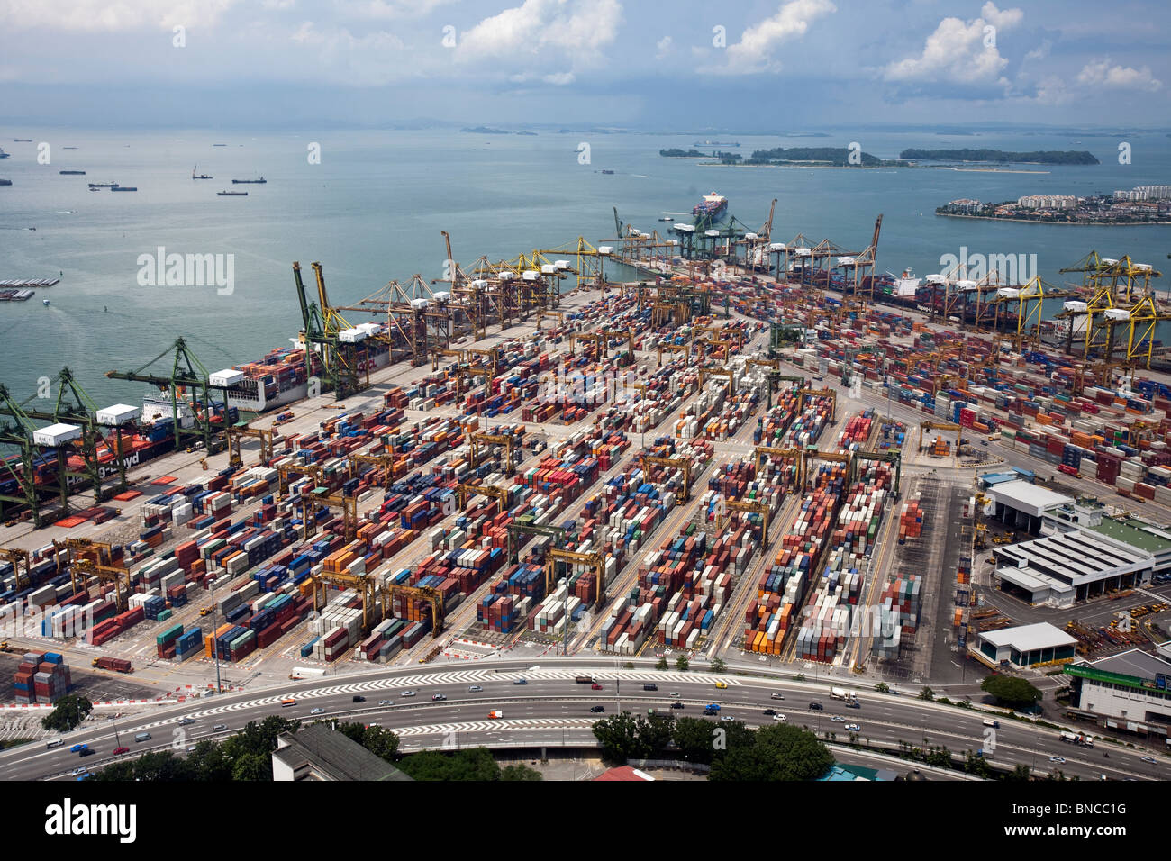 An elevated view shows containers and container ships in the port of ...