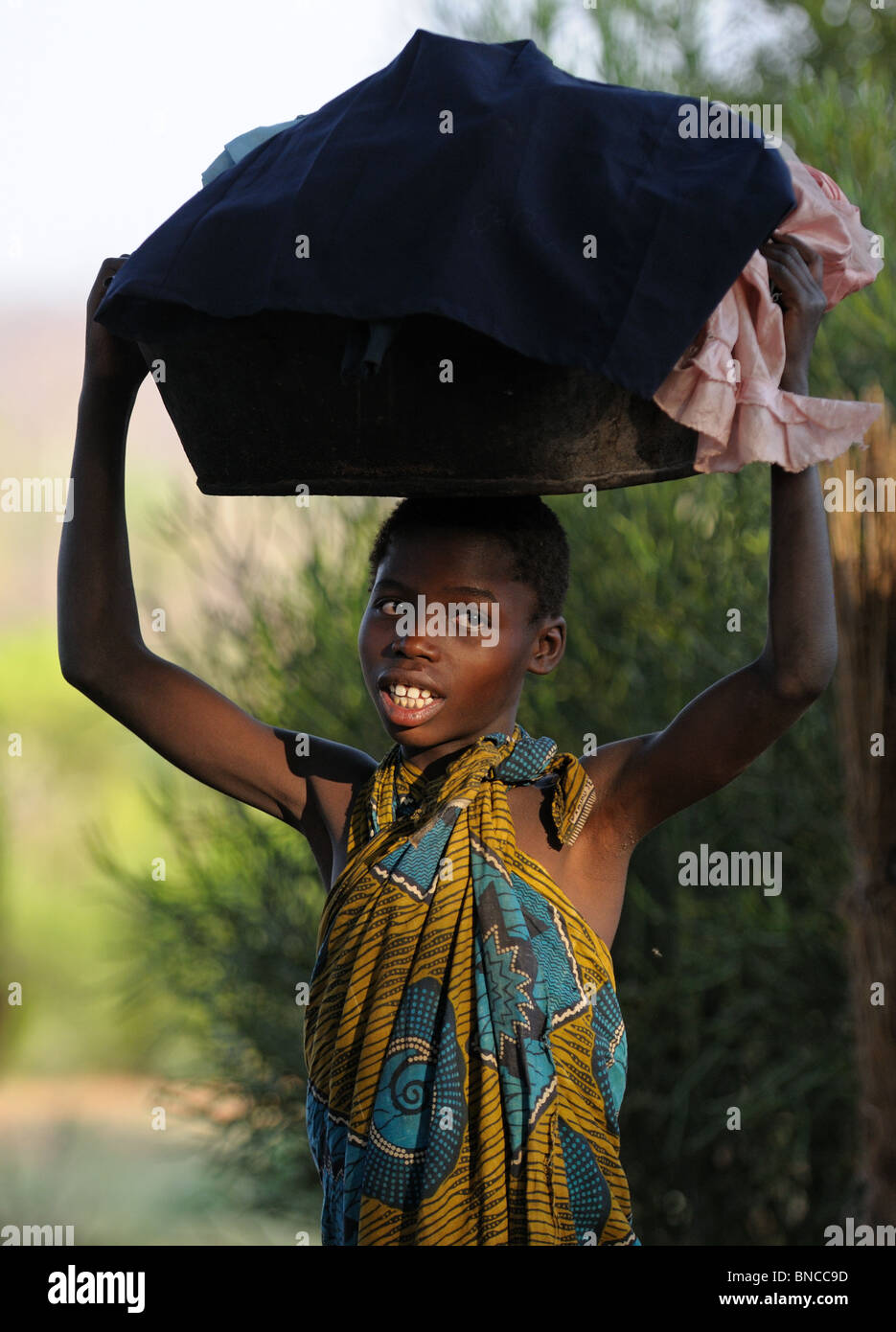 Child carrying laundry hi-res stock photography and images - Alamy