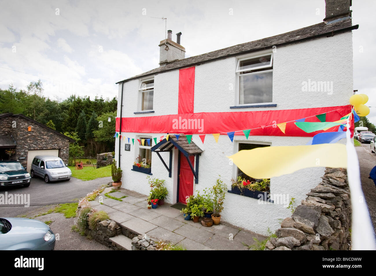 A house in Staveley, Lake District UK, with an England flag across it ...