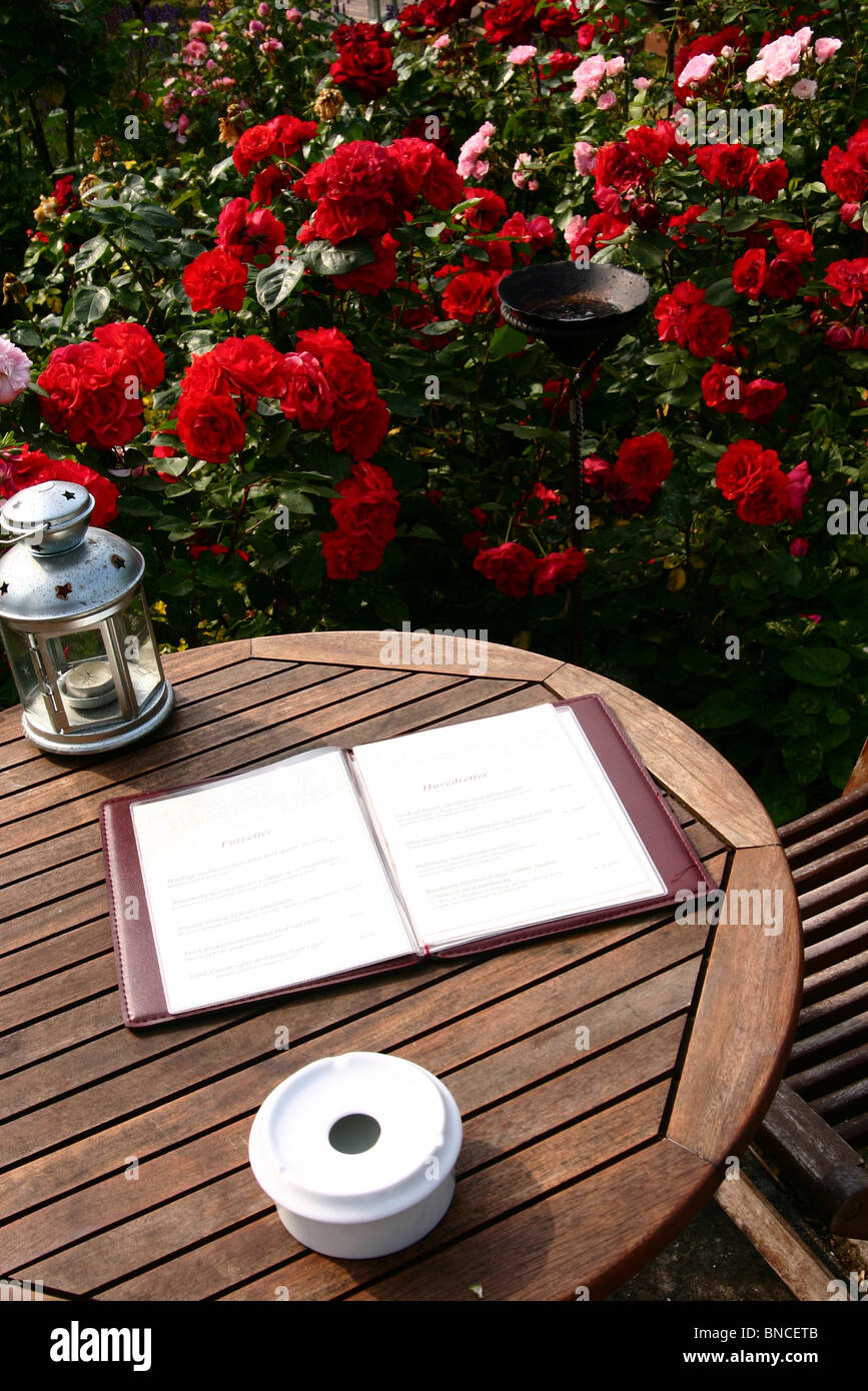 table of an outdoor restaurant with menu card Stock Photo - Alamy