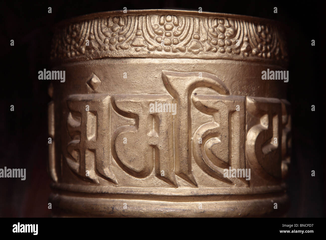 A gold painted prayer wheel in the Tashichho Dzong monastery in Thimpu ...