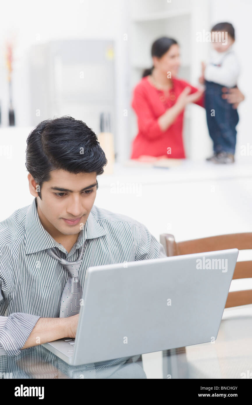 Man working on a laptop Stock Photo - Alamy