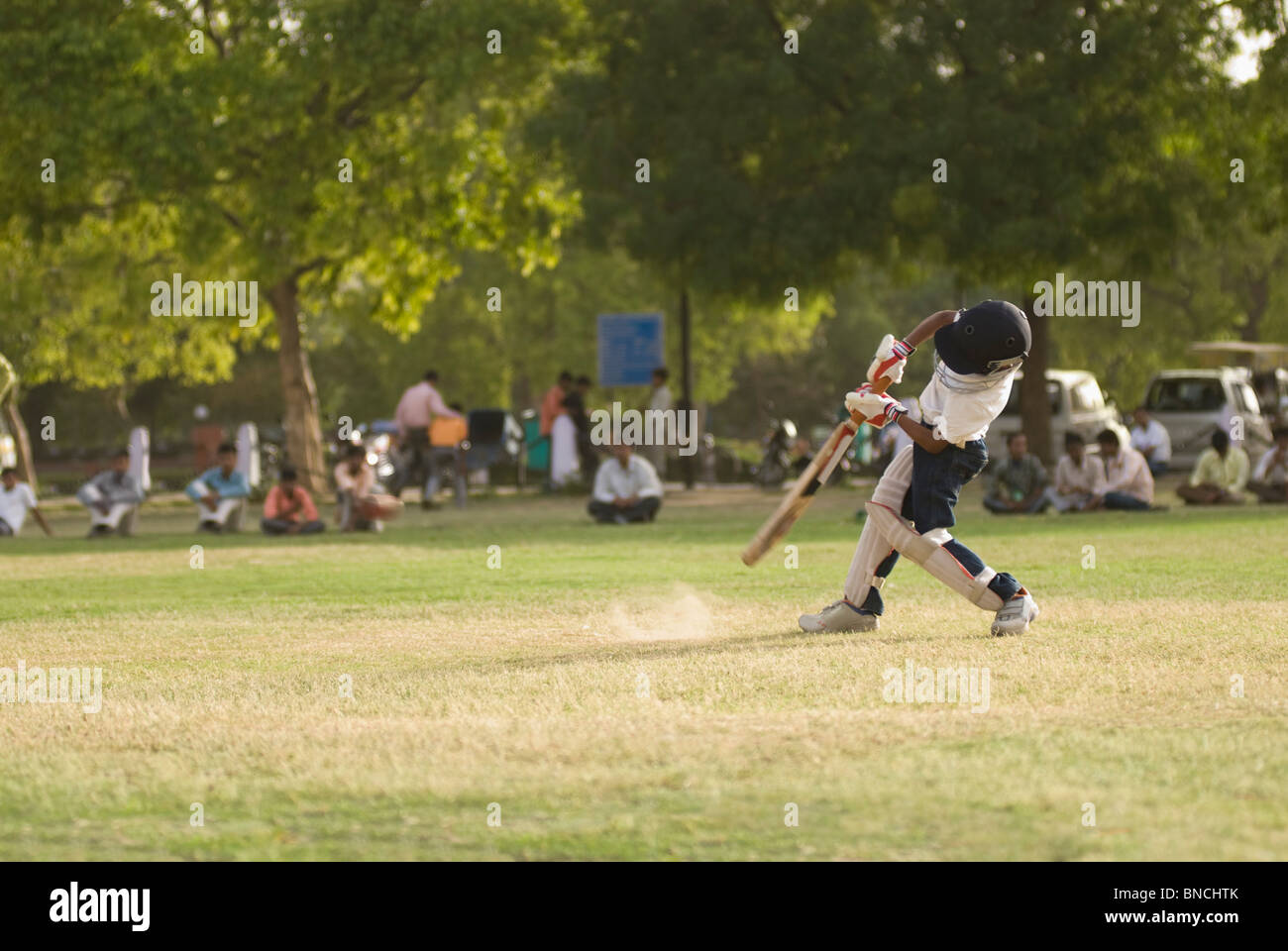 Boy playing cricket in playground hi-res stock photography and images ...