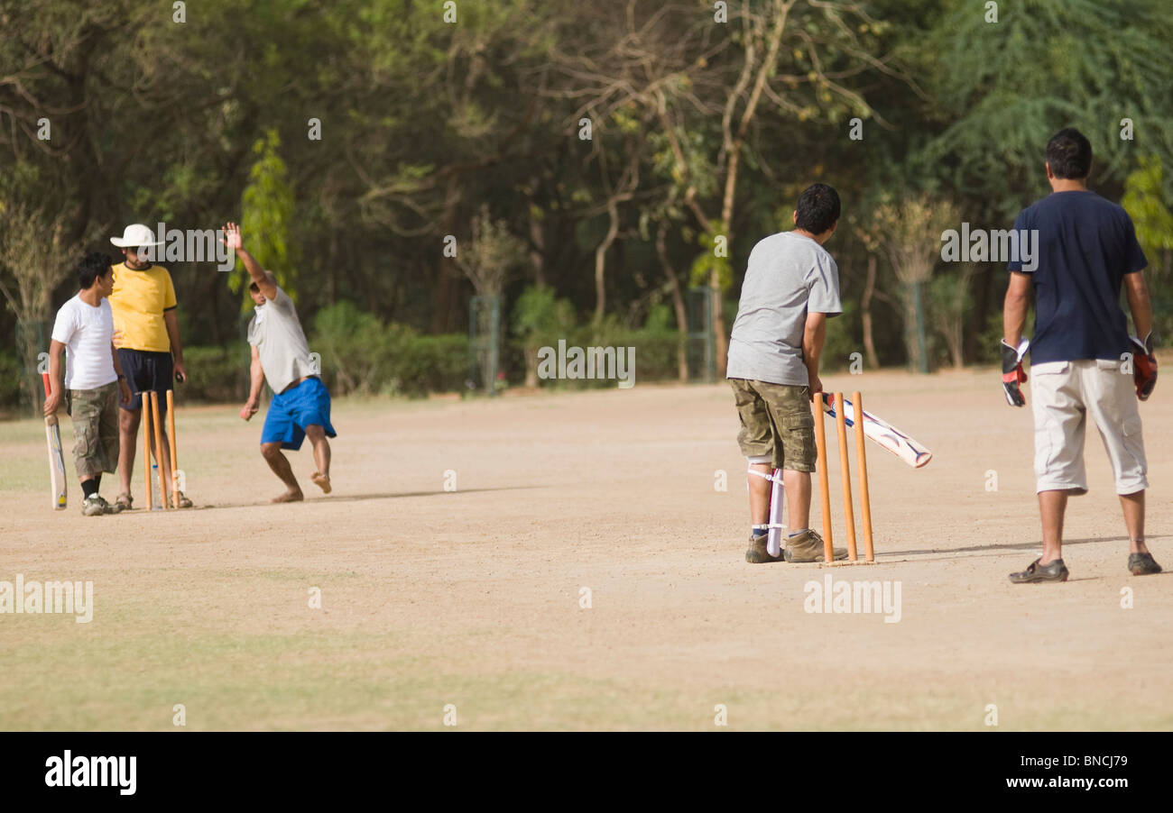 Boys playing cricket in a playground, New Delhi, India Stock Photo - Alamy